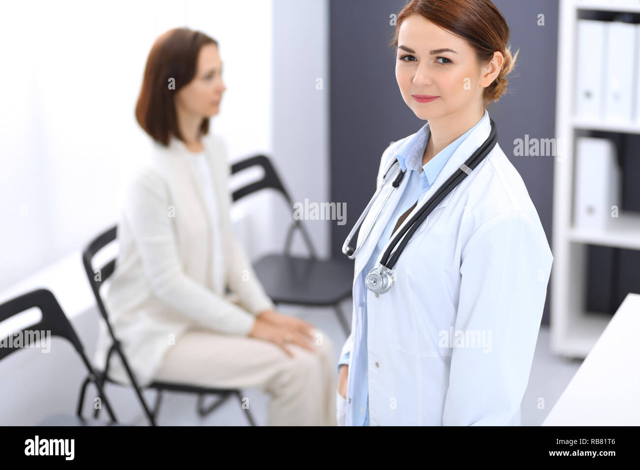 Doctor woman at work. Portrait of female physician cheerful smiling ...