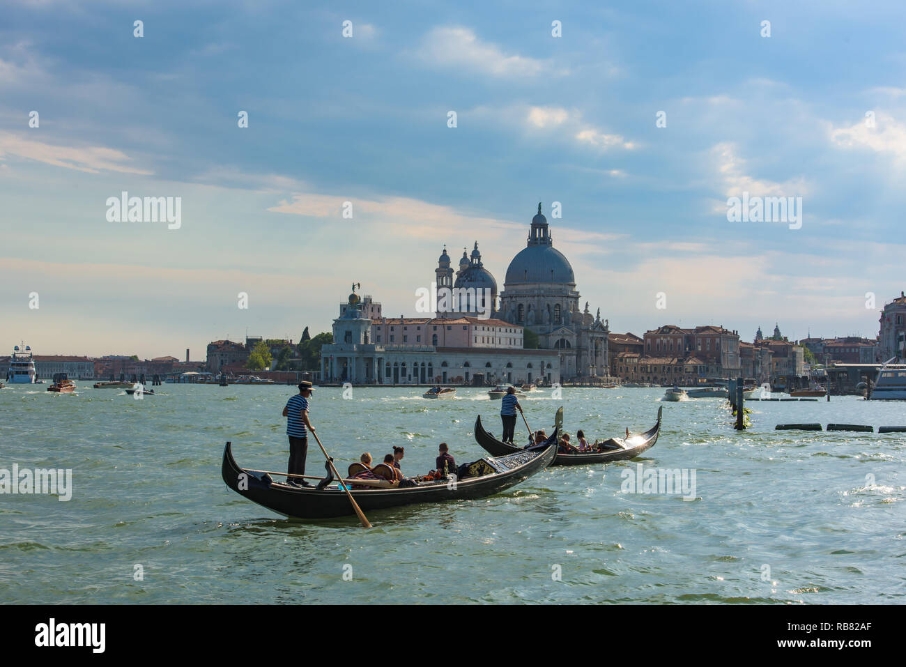 Gondola on the lagoon in venice in background Santa Maria della Salute ...
