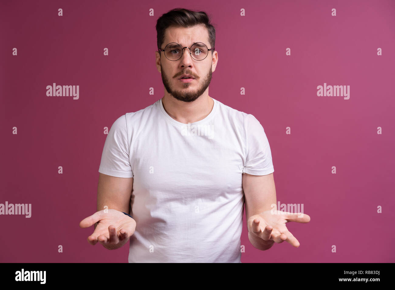 Mistake or sorry concept - young man confused Stock Photo - Alamy