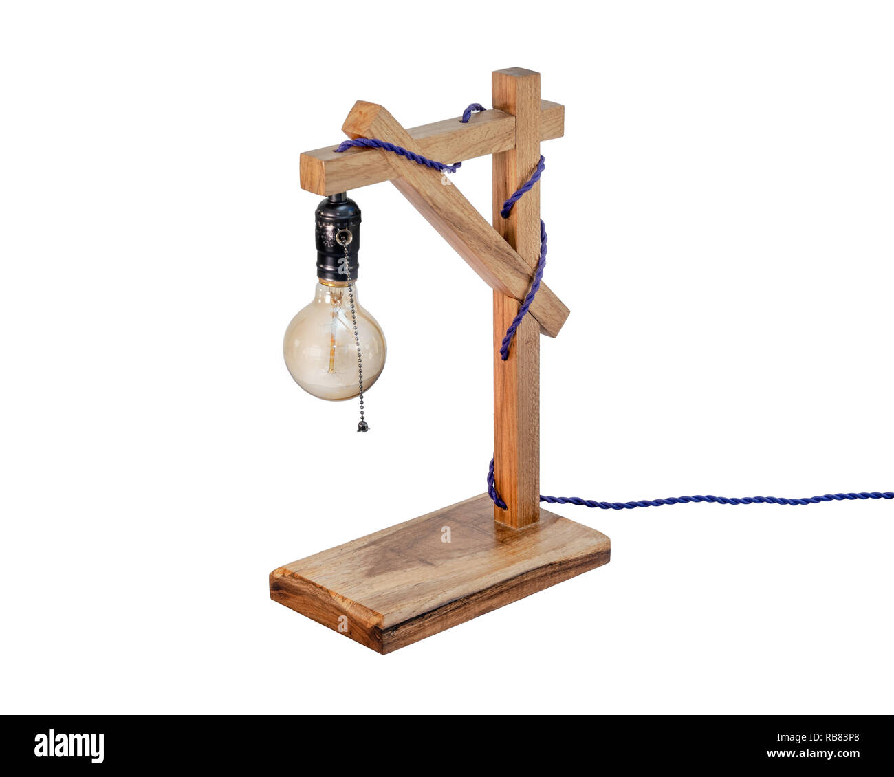 Rustic wood table lamp with small white lampshade isolated on white ...