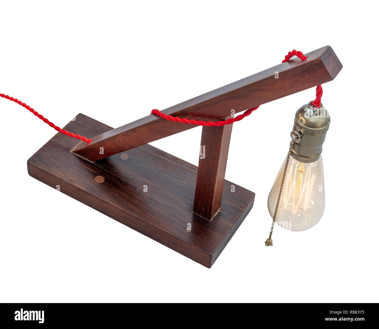 Rustic wood table lamp with small white lampshade isolated on white ...