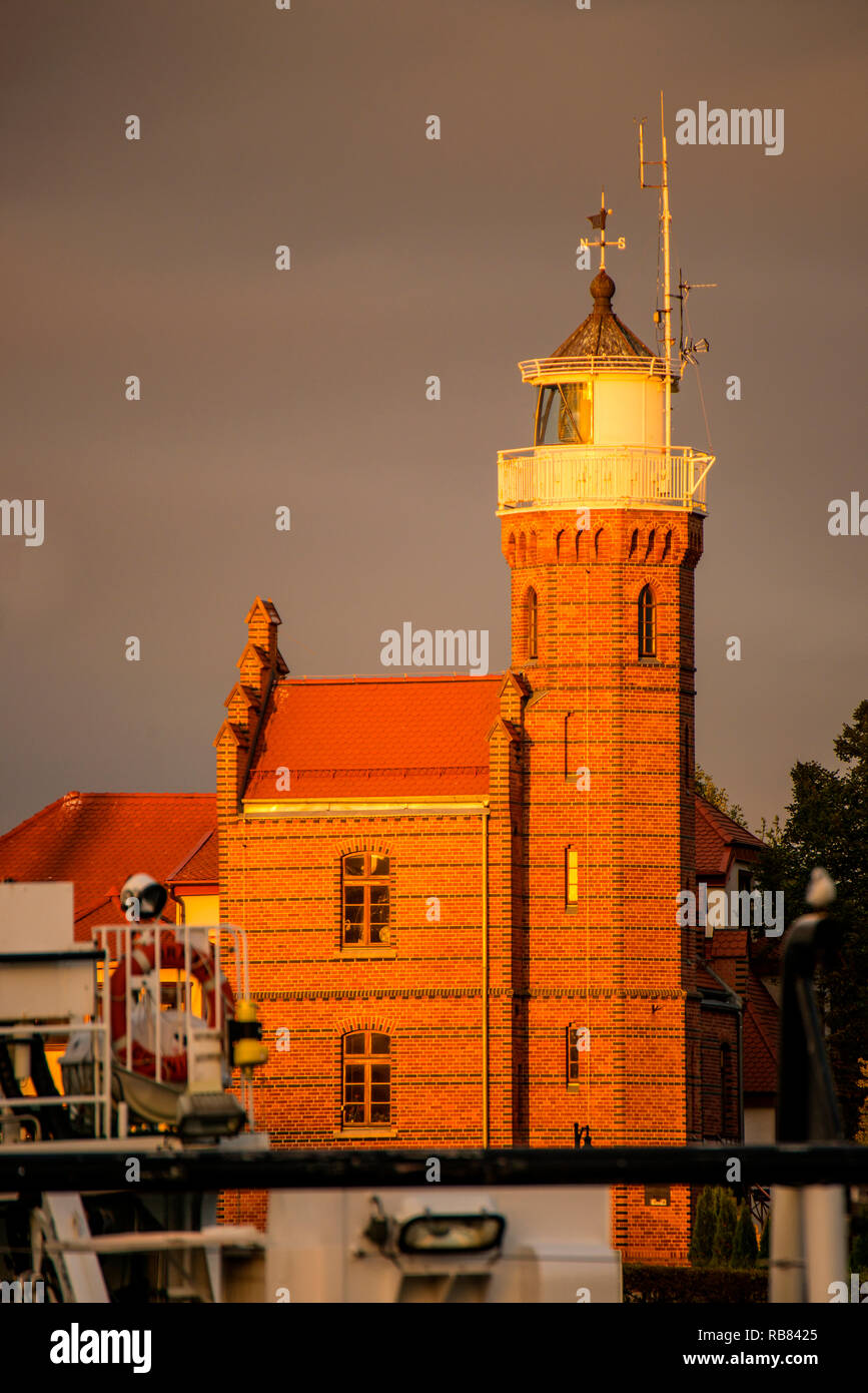 Old lighthouse in golden evening lighting Stock Photo - Alamy