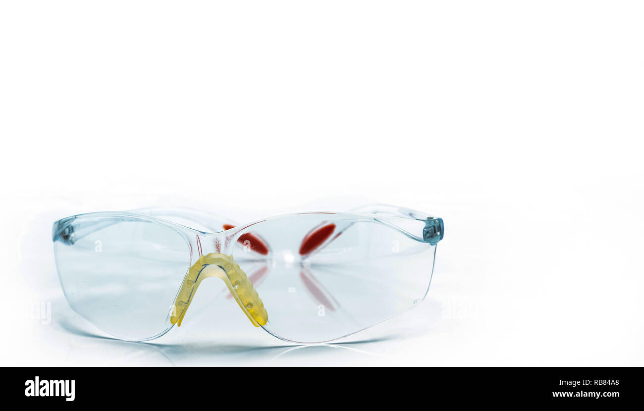 Plastic safety glasses isolated on white background. Goggles for ...