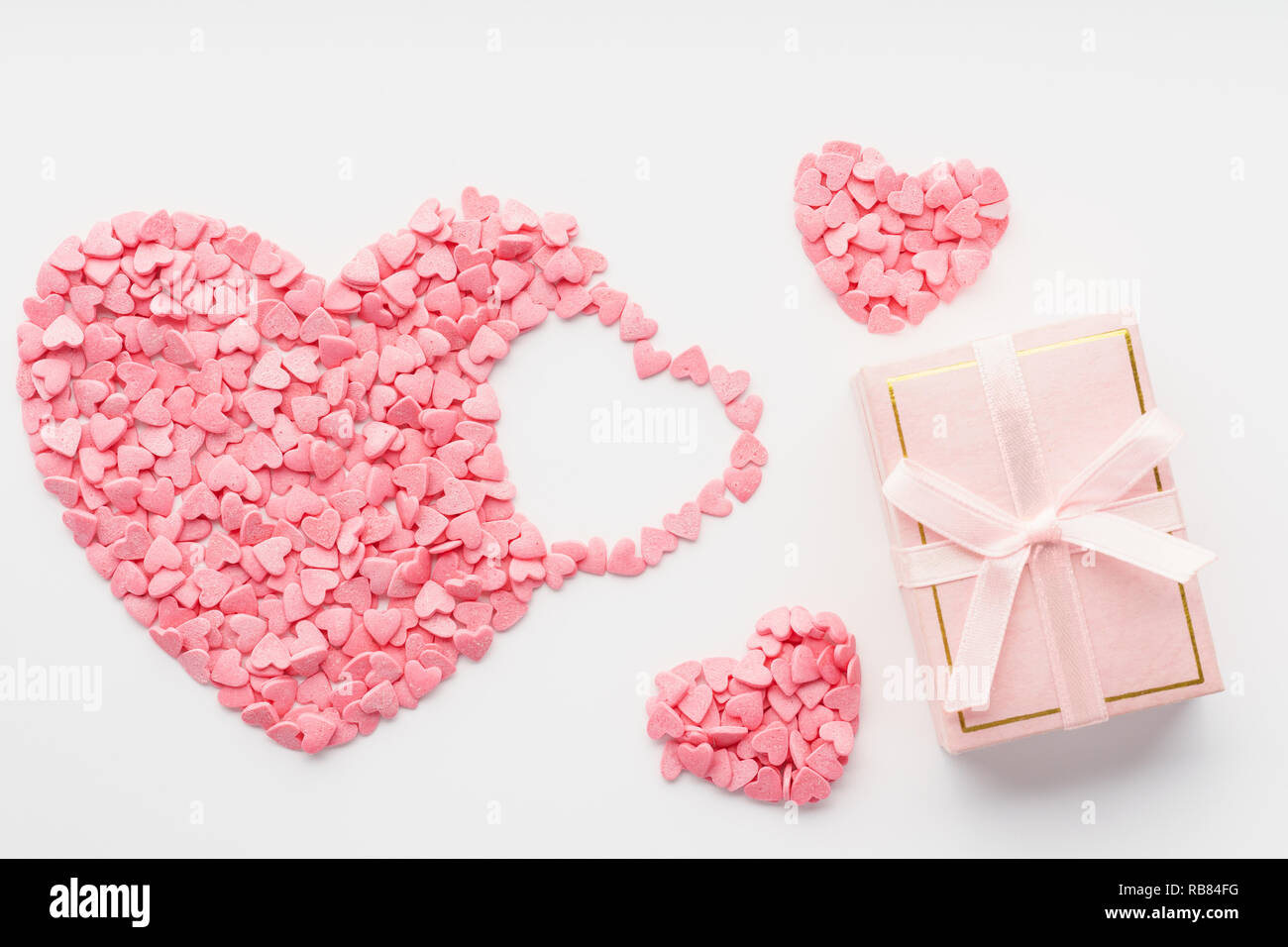 Valentine's Day concept with pink candy hearts and a gift box Stock ...
