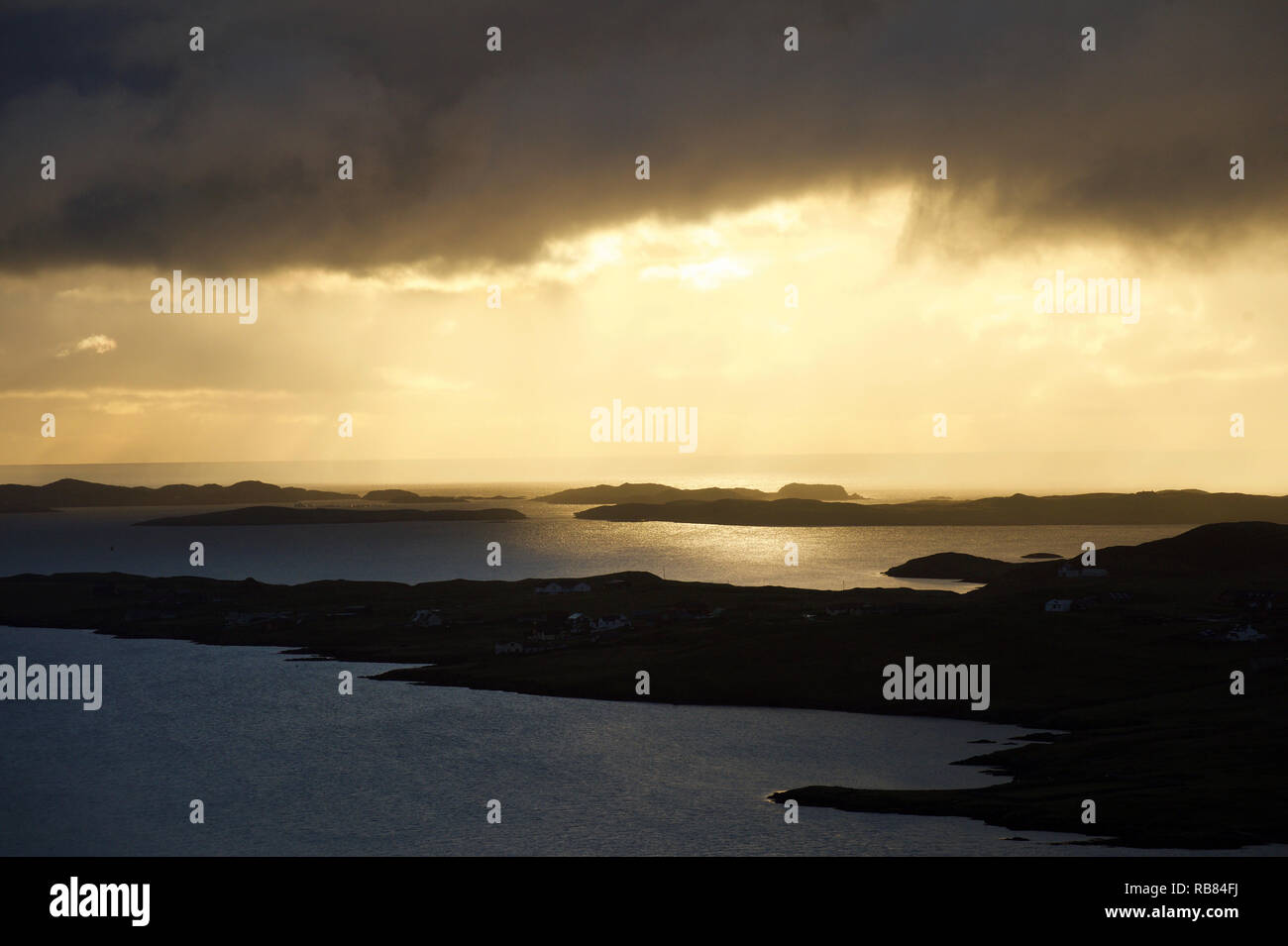 Dark storm clouds roll over a dramatic Shetland landscape—moody skies ...