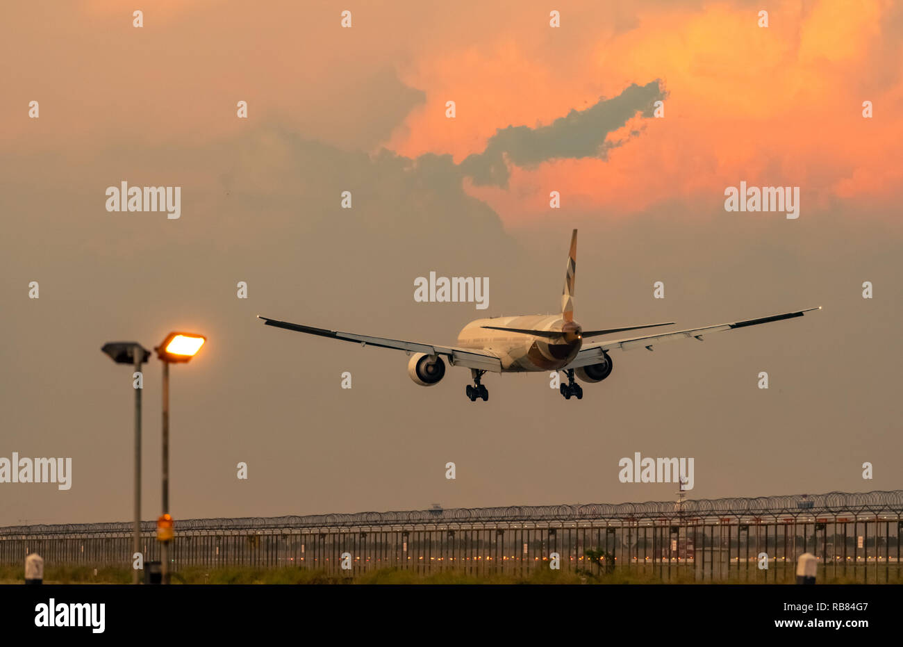 Commercial airline. Passenger plane landing at airport with beautiful ...