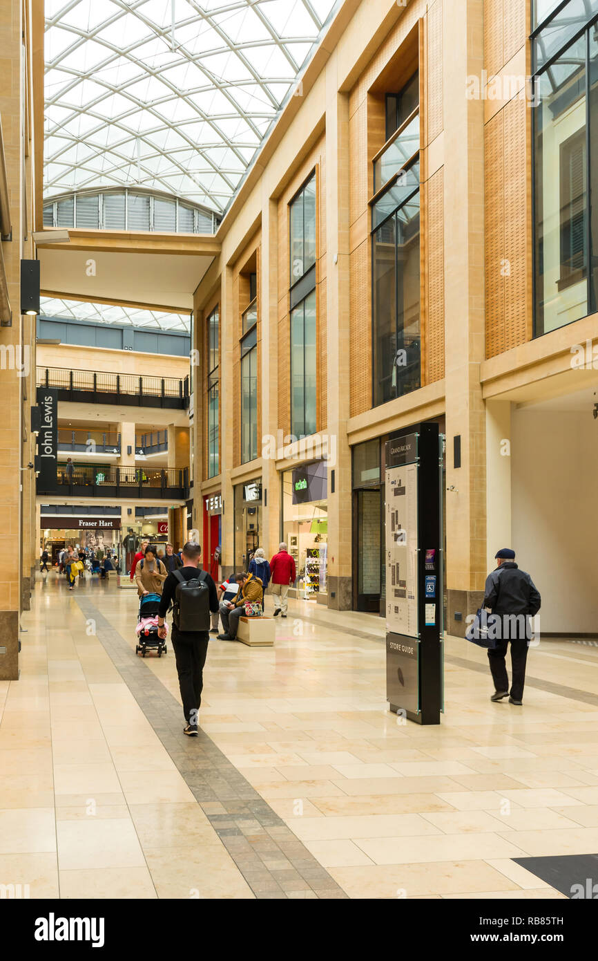 Interior of the Grand Arcade shopping centre with people walking past ...