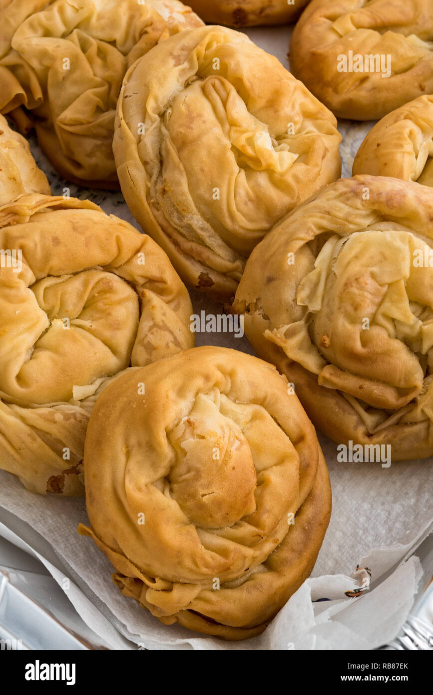 Baked homemade traditional Greek cheese pies Stock Photo - Alamy