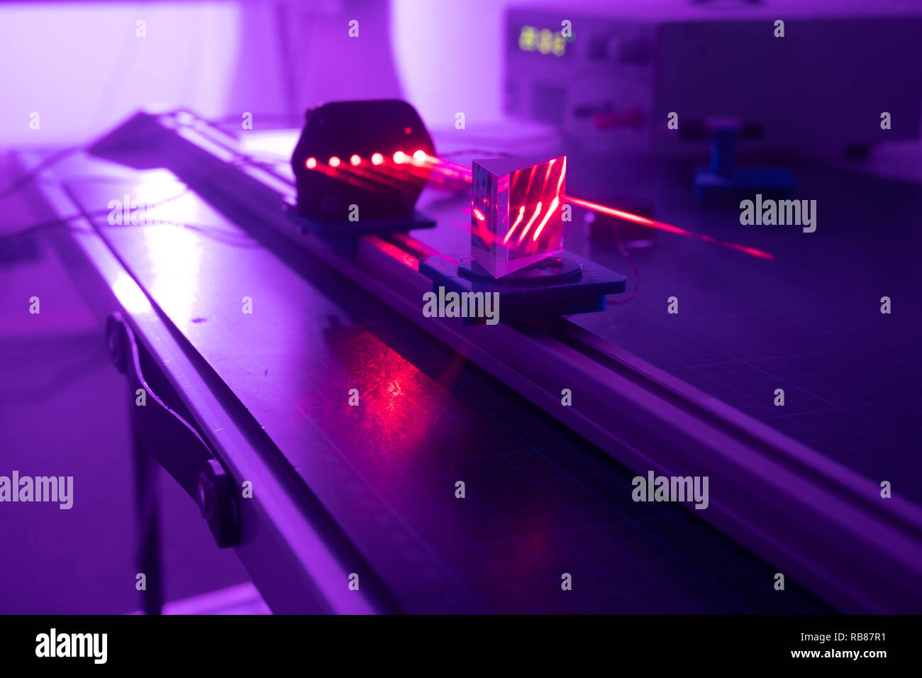 Experiment with red laser in optics lab Stock Photo - Alamy