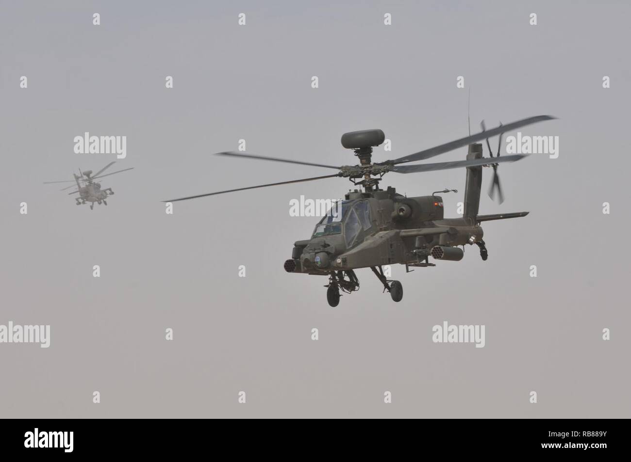 AH-64 Apache Helicopters prepare to engage a target during a joint ...