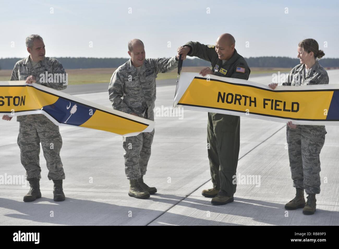 U.S. Air Force Col. Jimmy Canlas 437 Airlift Wing commander, middle ...