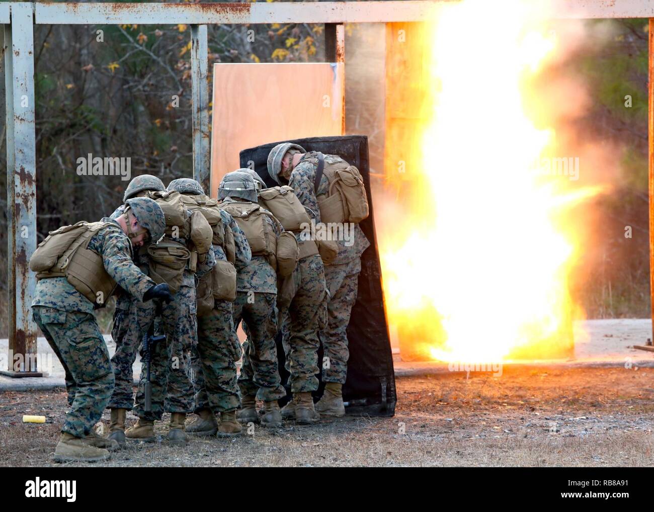Marines take cover while setting off a detonation cord linear charge ...