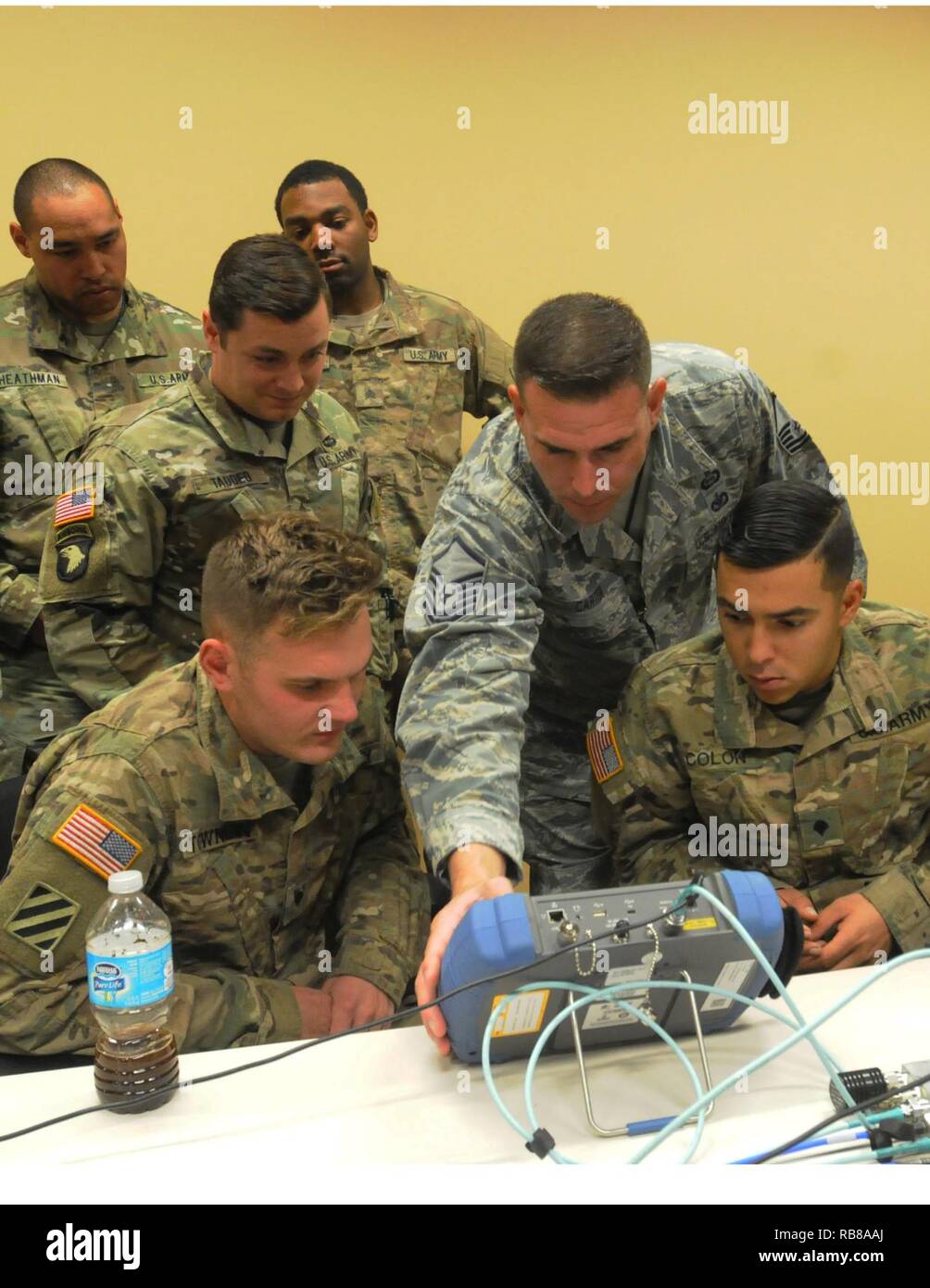 U.S. Air Force Master Sgt. Joshua Carter, center, flight chief ...