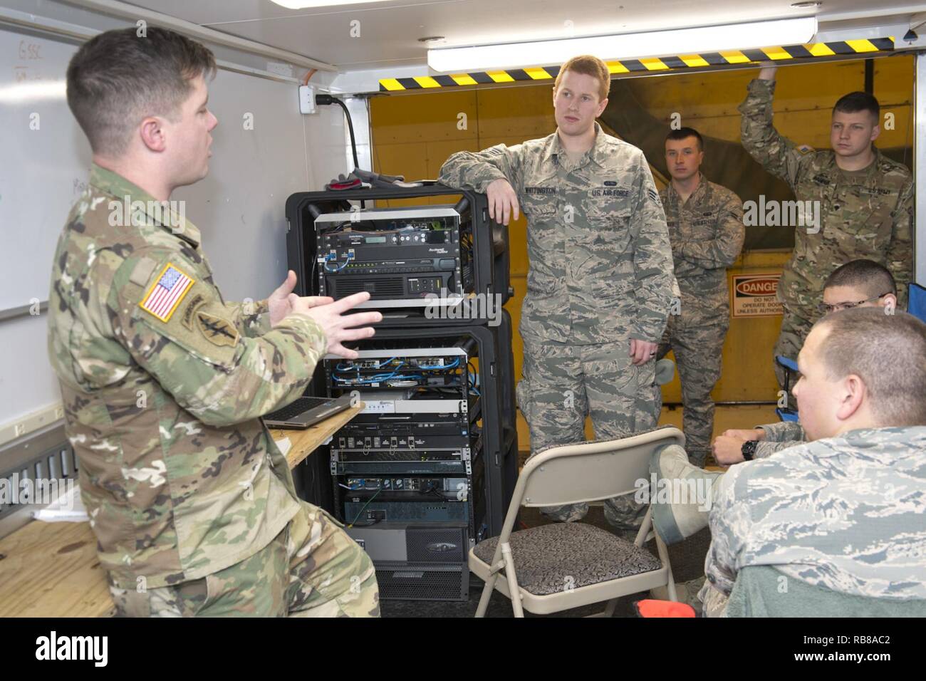 U.S. Army Staff Sgt. Michael Copen, left, a computer network technician ...