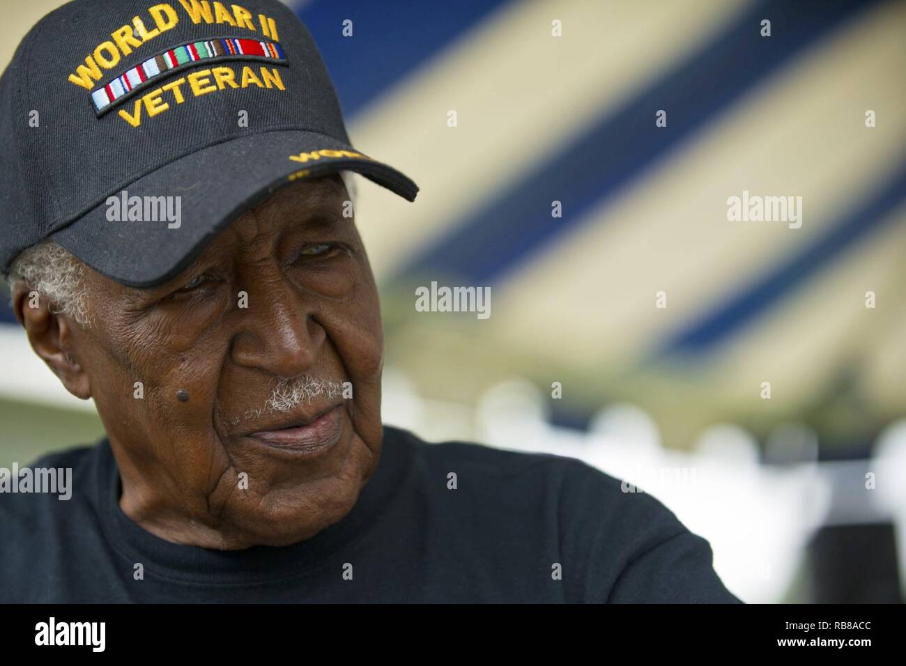 Navy retired Chief Petty Officer Carl Clark, 100, attends the ceremony ...