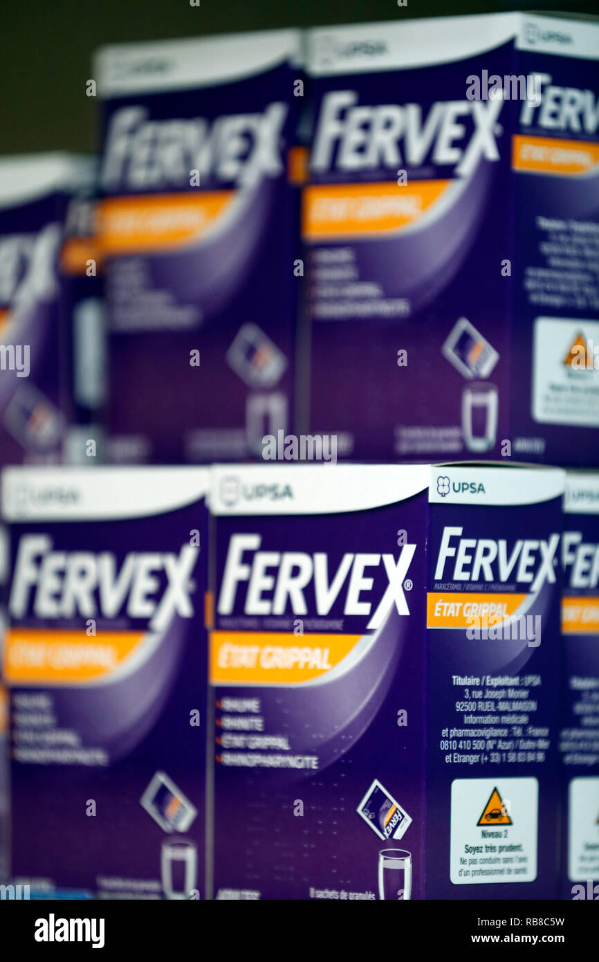 Pharmacy. Medicine in shelves. Rhinitis treatment. France. Fervex Stock ...