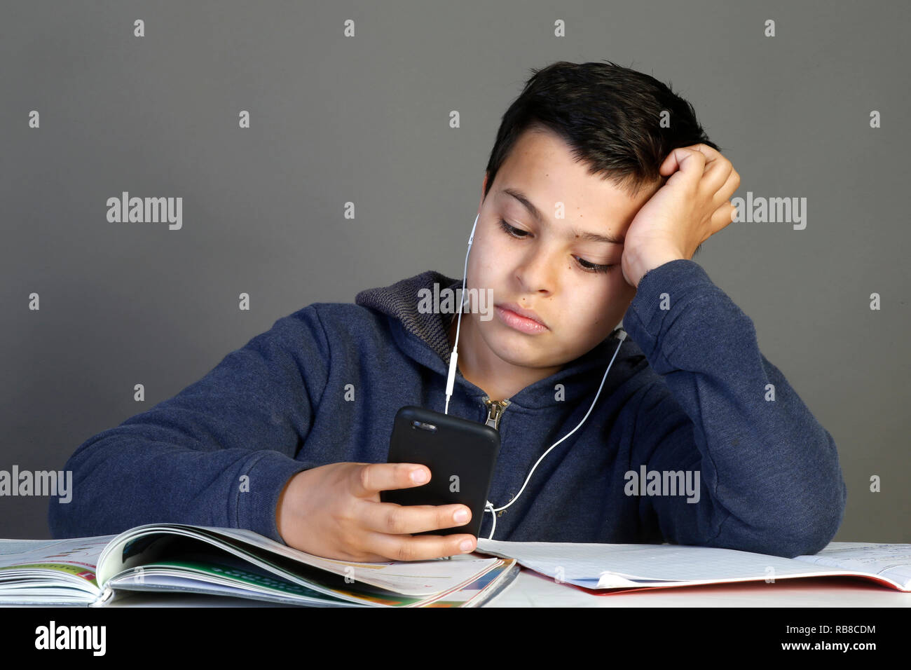 12-year-old schoolboy using a cell phone. Paris, France Stock Photo - Alamy