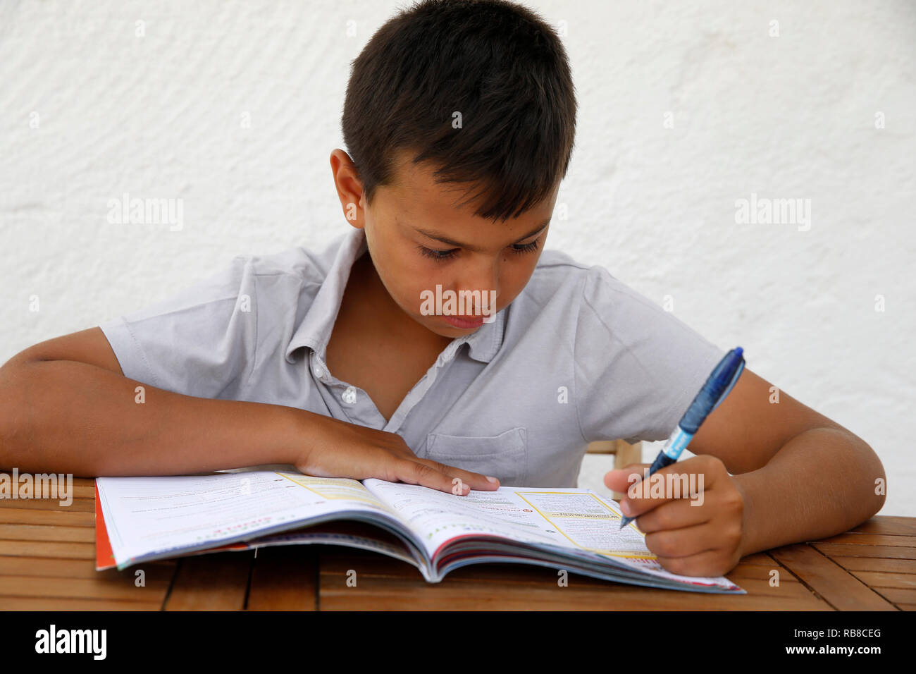 11-year-old boy doing homework in Salento, Italy Stock Photo - Alamy
