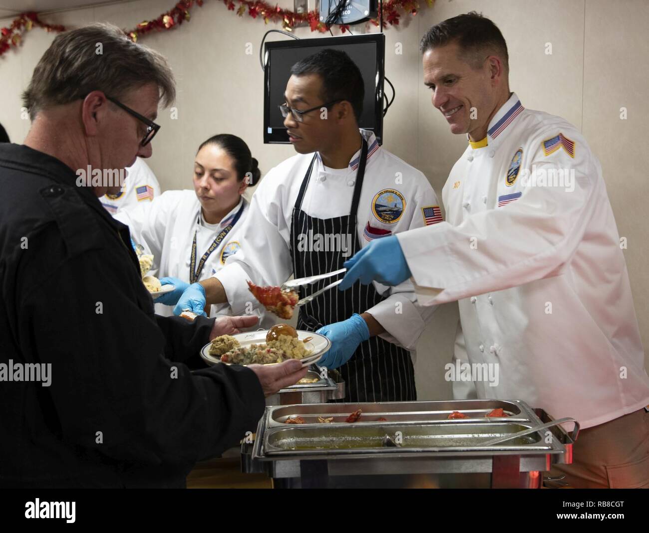 NEWPORT NEWS, Va. (Nov. 22, 2018) -- Capt. Brent Gaut, right, USS ...