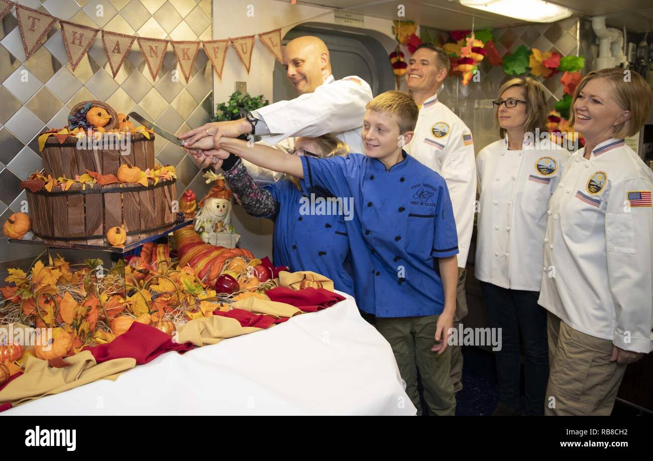 NEWPORT NEWS, Va. (Nov. 22, 2018) -- Capt. John J. Cummings, foreground ...