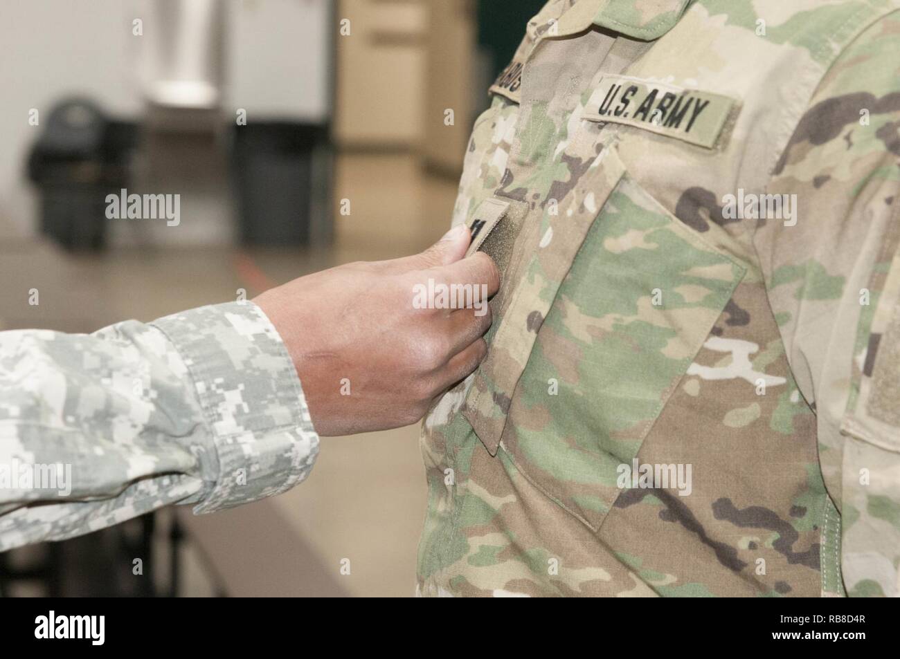 Maj. Jaison Bloom (left), the 326th MPAD Commanding Officer, promotes ...