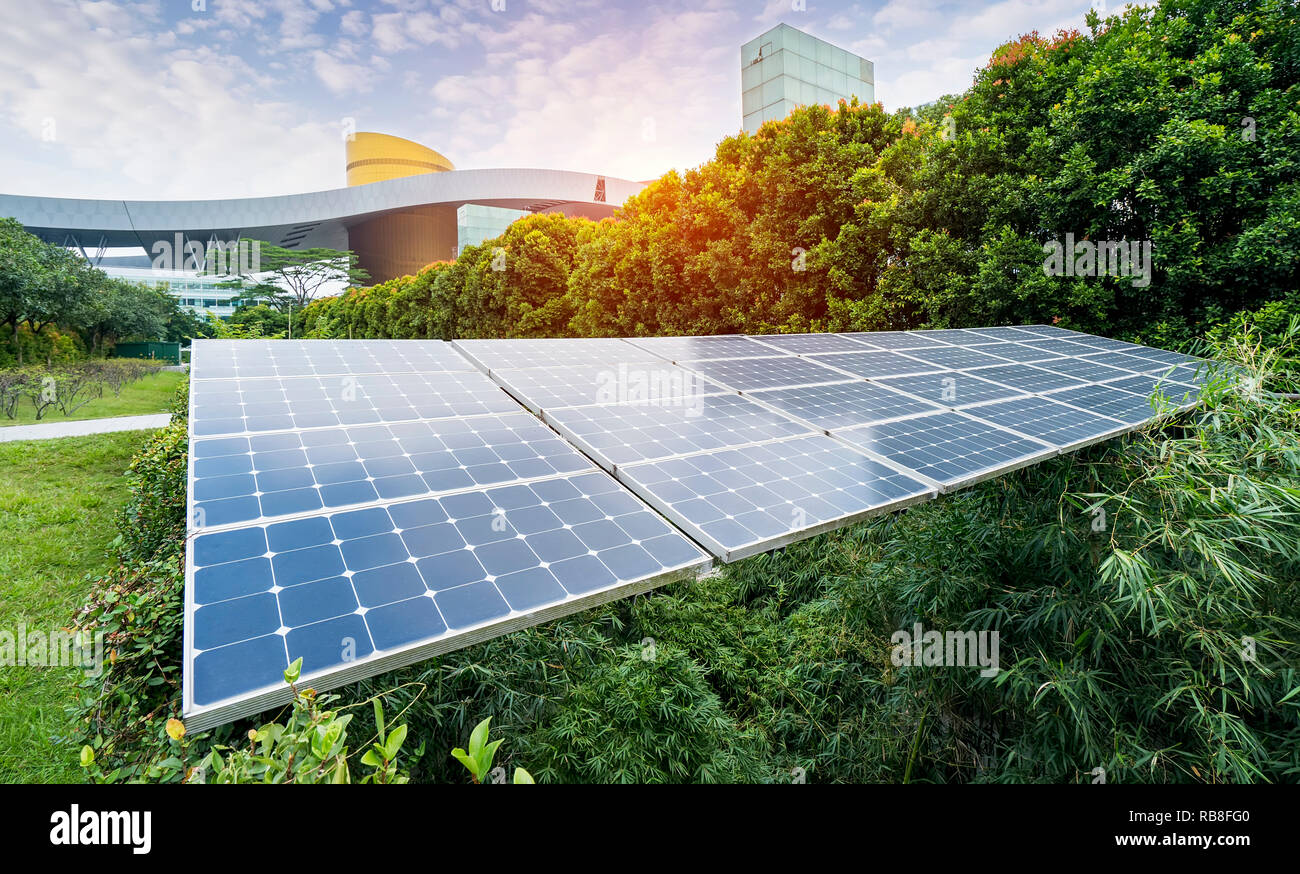 Ecological energy renewable solar panel plant with urban landscape ...