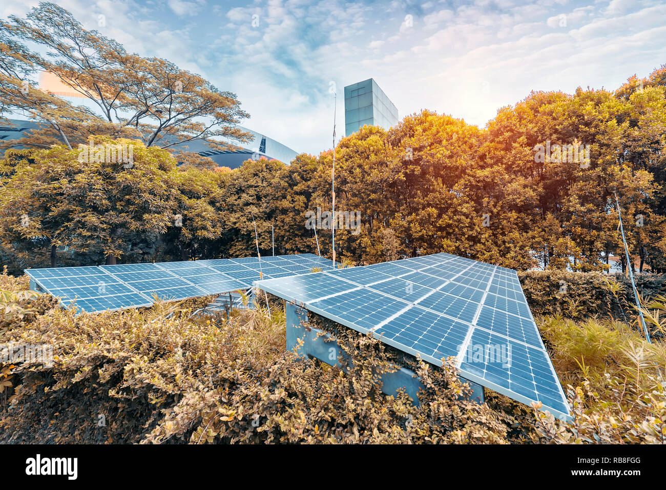 Ecological energy renewable solar panel plant with urban landscape ...