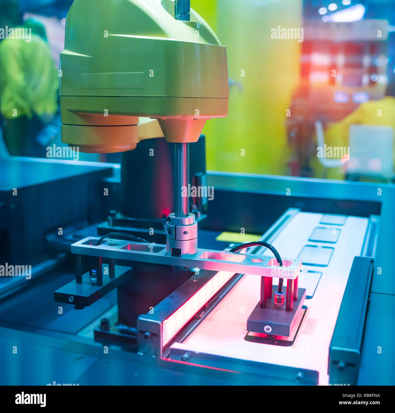 Industrial robot working in Factory for production of mobile phones ...