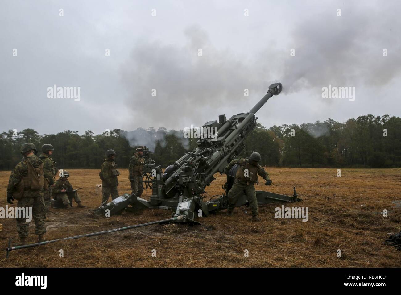 Marines fire a 155mm Howitzer helicopter during a Helicopter Support ...