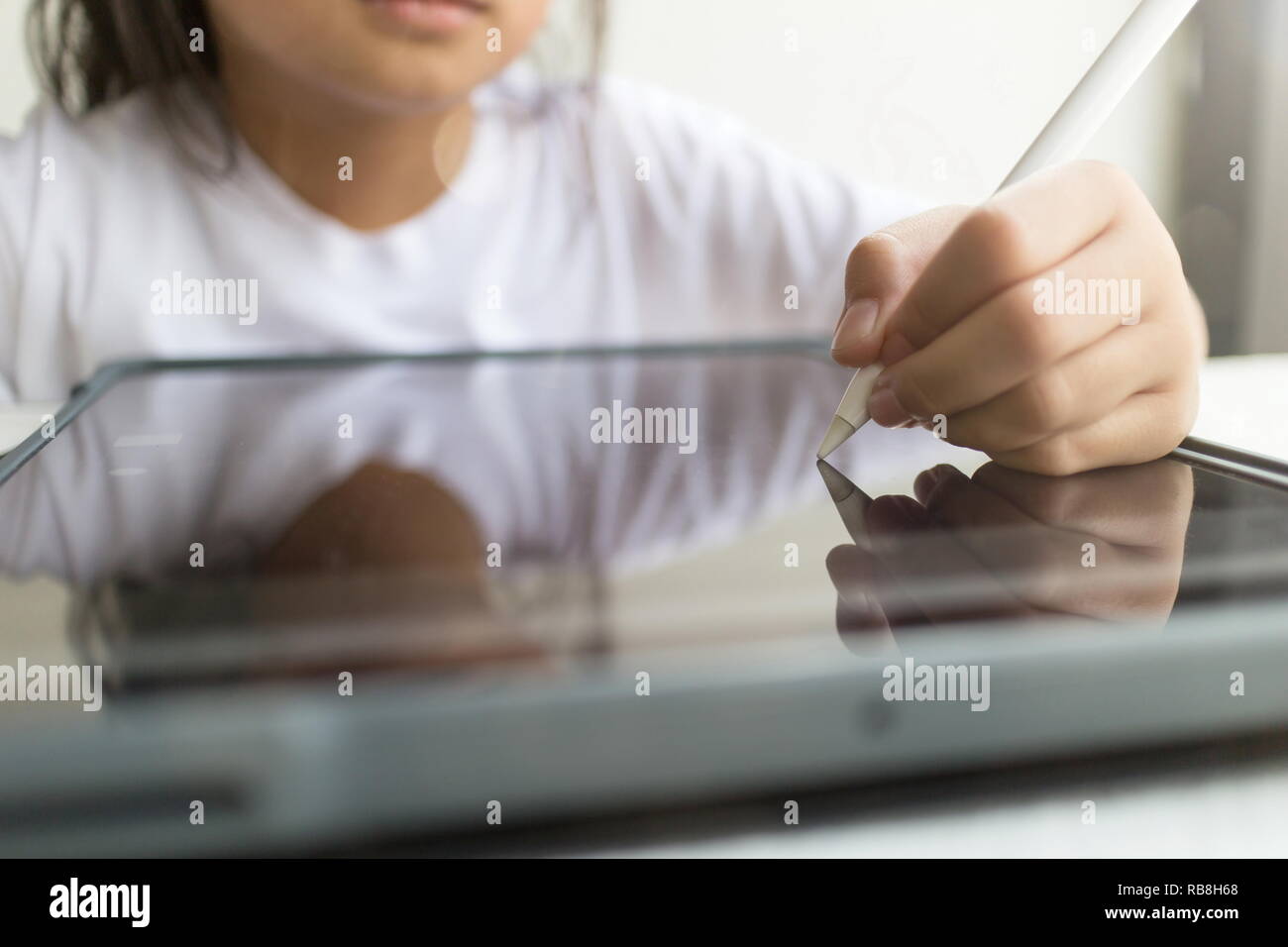 Kid tablet stylus hi-res stock photography and images - Alamy