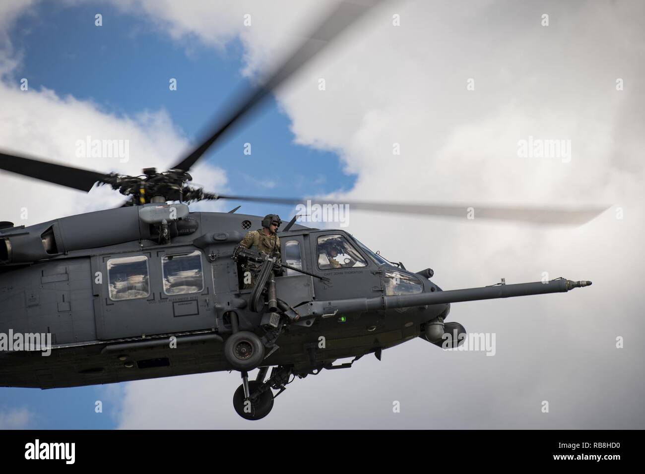 A special missions aviator from the 41st Rescue Squadron scans for ...