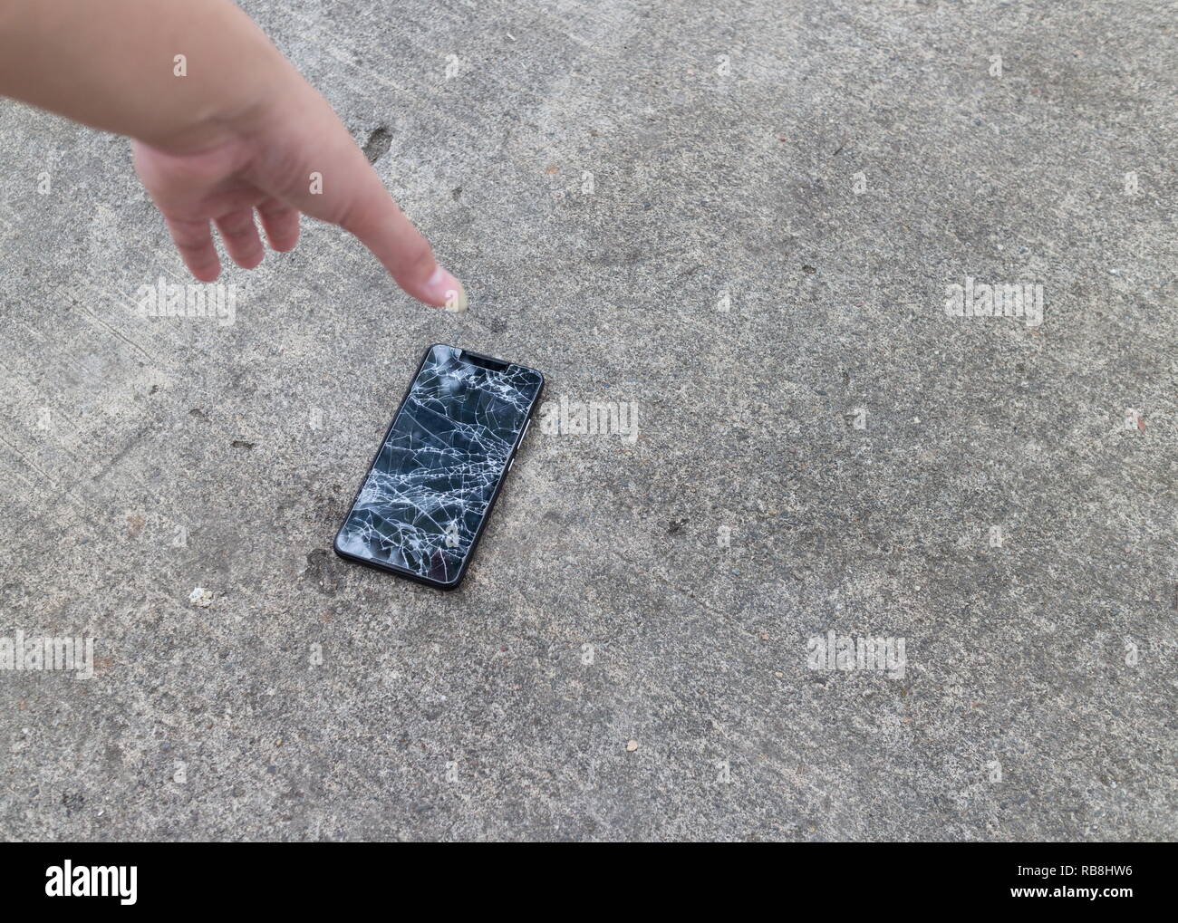 Smartphone fall out of hand and fall to the cement floor and the touch ...