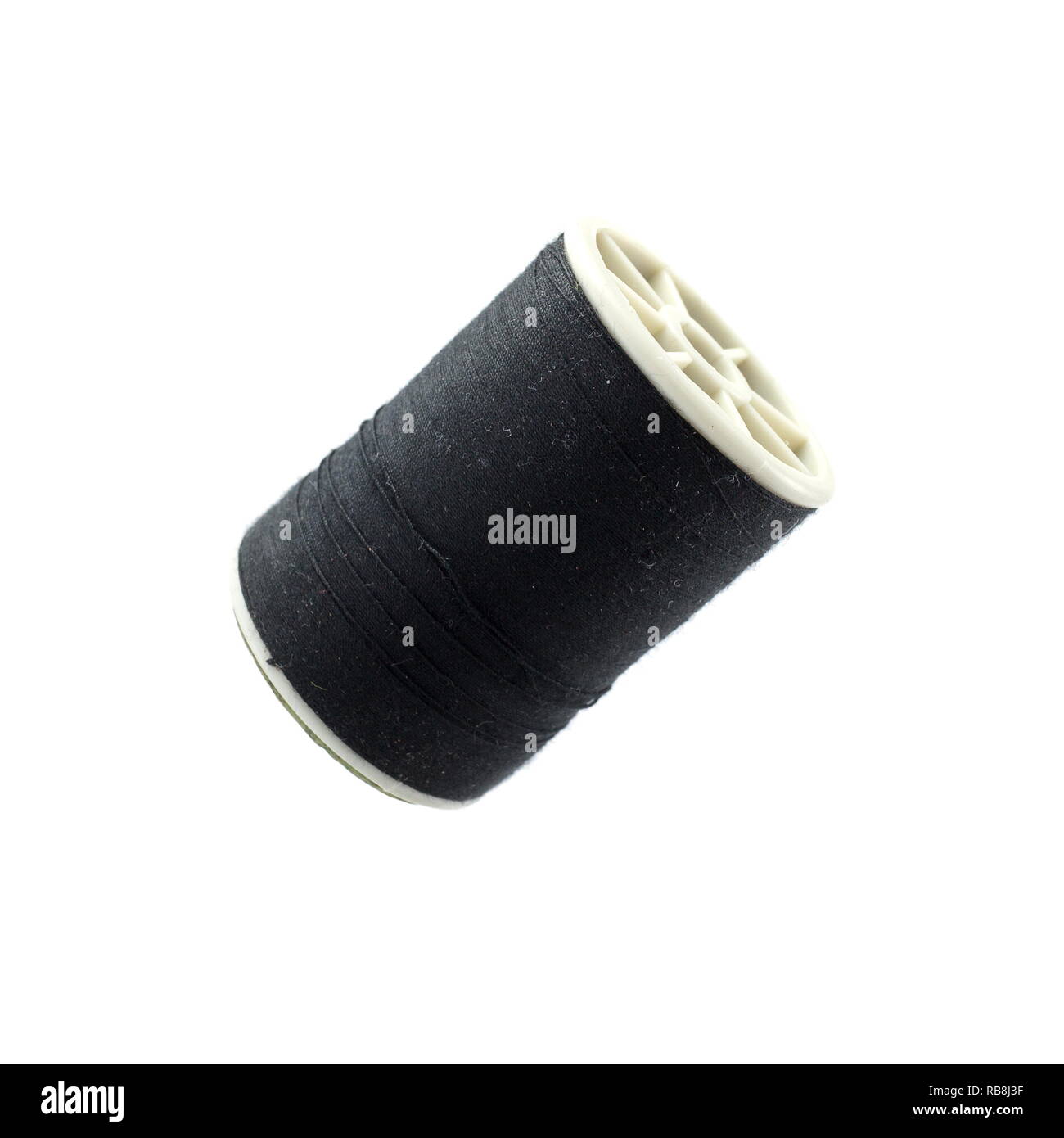 spool of thread isolated on a white background Stock Photo - Alamy