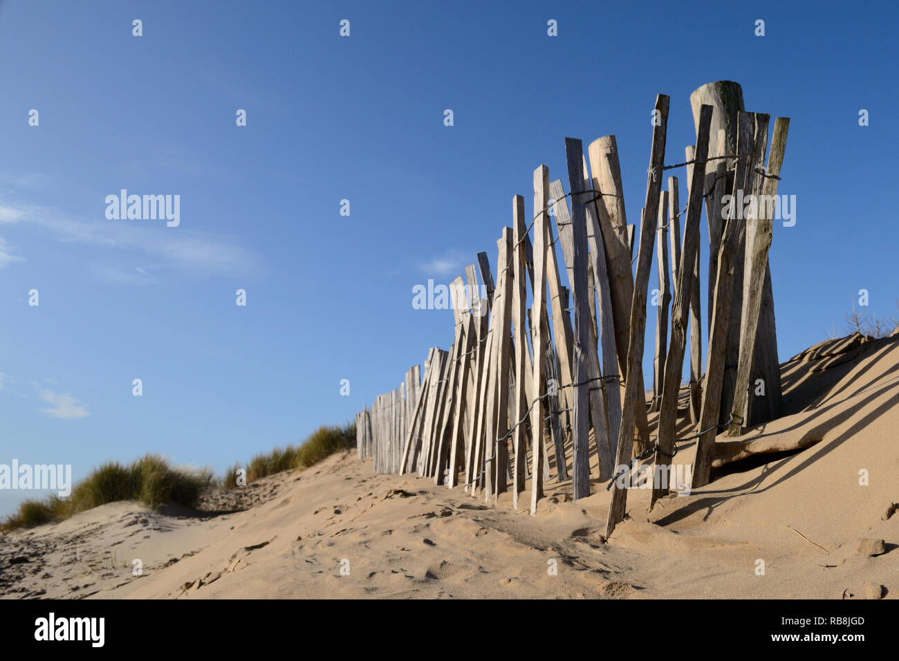 Old wooden fence leading to the sea at Formby Beach, England Stock ...