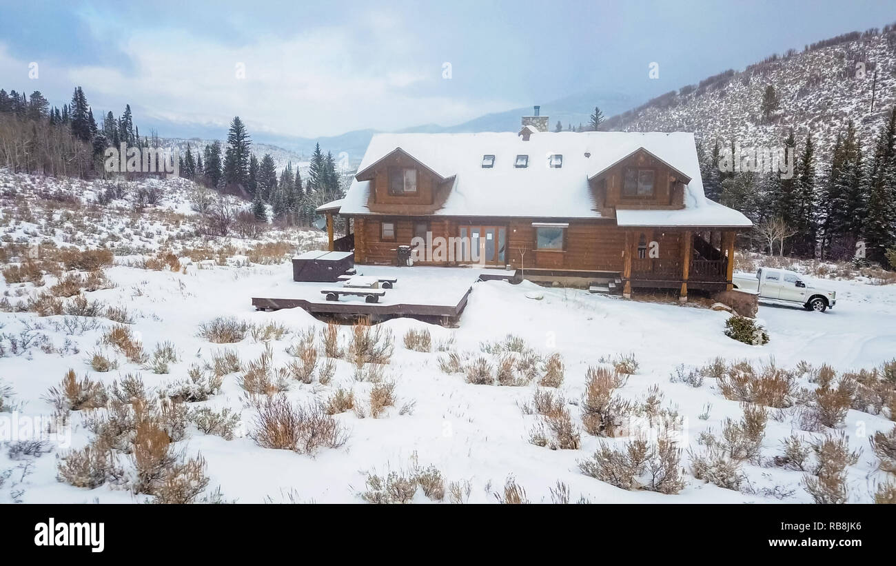 Aerial view of the mountain house covered in snow in the Winter Stock ...