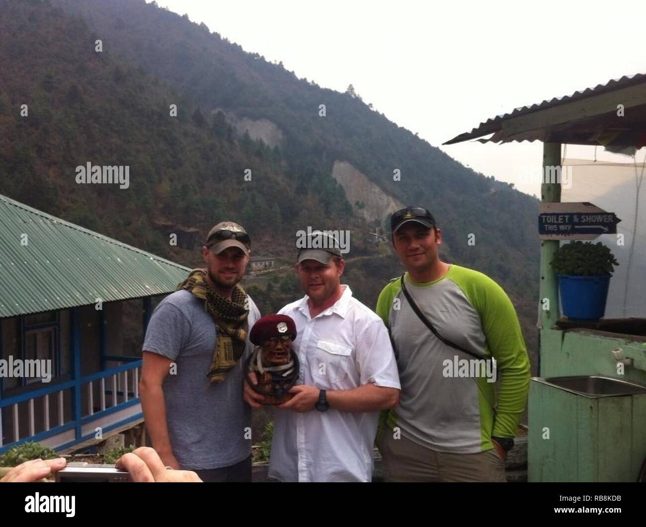 Then-Senior Master Sgt. Robert Disney, a Wounded Warrior and PJ, holds ...