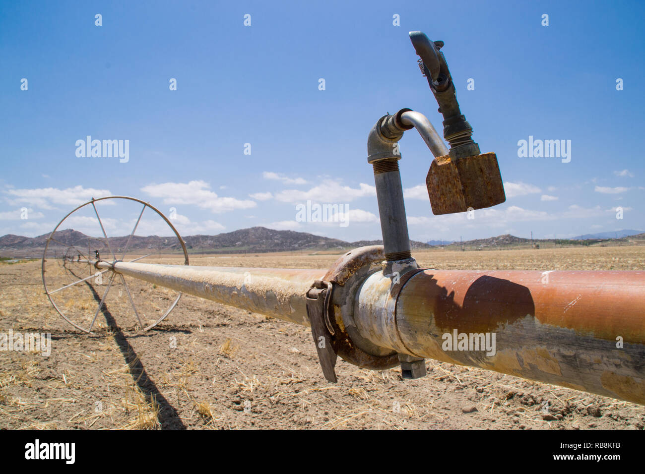 The water irrigation pipes in the dry Southern California farmland ...