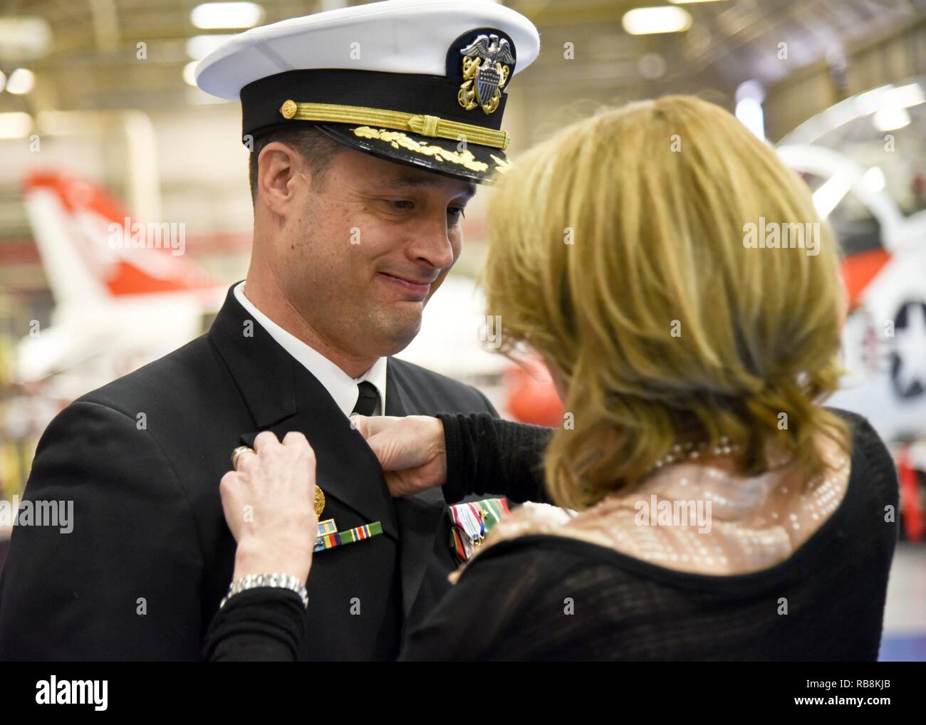 MERIDIAN, Miss. (Dec. 16, 2016) Tonja Gustin, right, pins a Navy ...