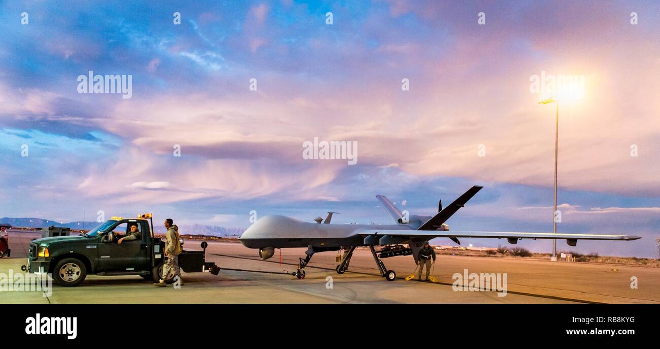 Airmen of the 49th Aircraft Maintenance Squadron tow an MQ-9 Reaper ...