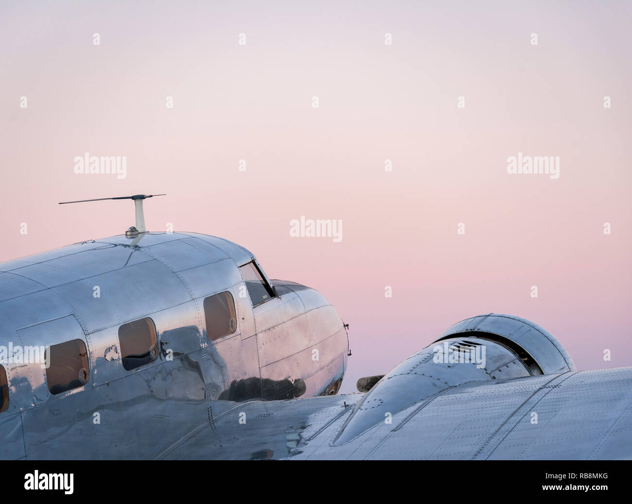 Vintage silver passenger aircraft against a beautiful dusk sky Stock ...
