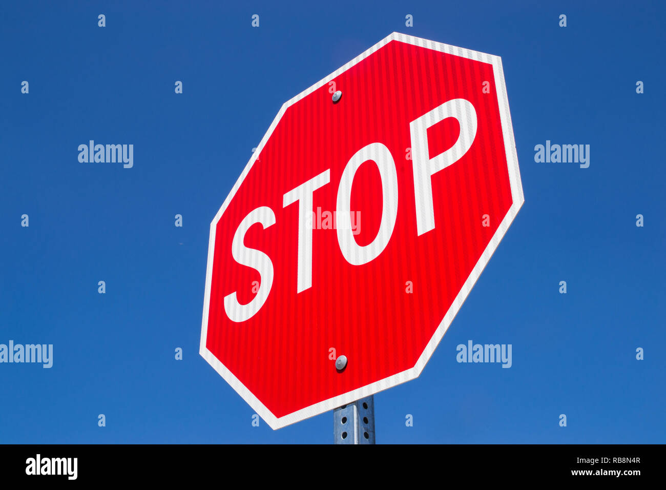 The stop sign in the California blue skies Stock Photo - Alamy