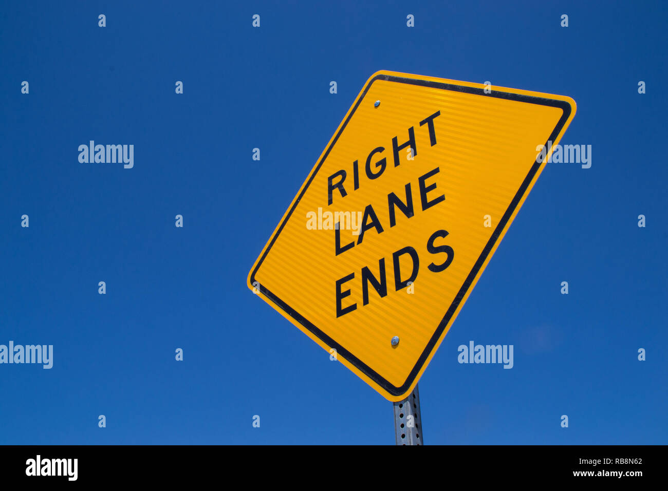 The "Right lane ends" sign in the Southern California sun Stock Photo ...