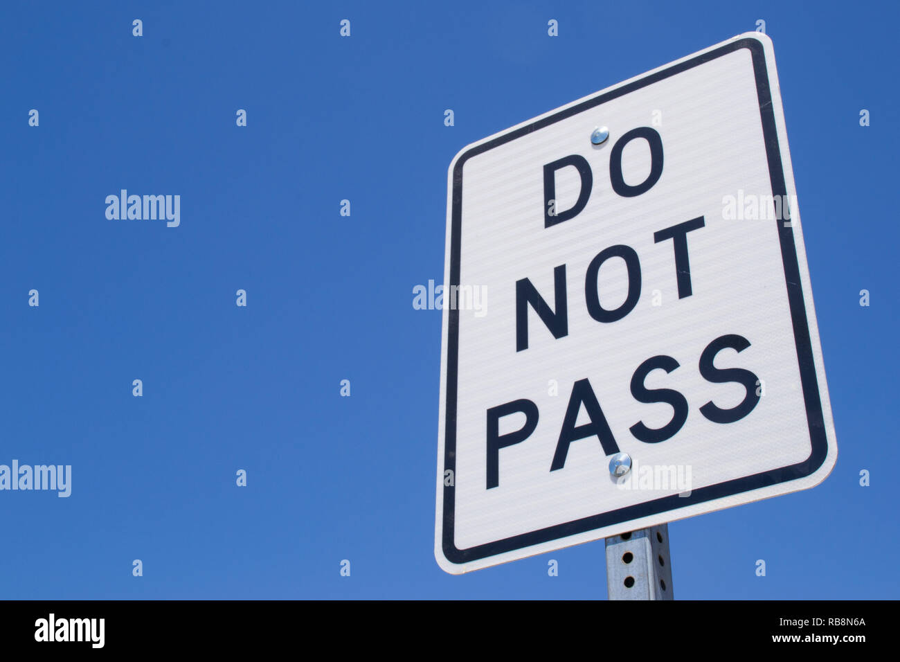 The "Do not pass" sign with California blue skies in the background ...