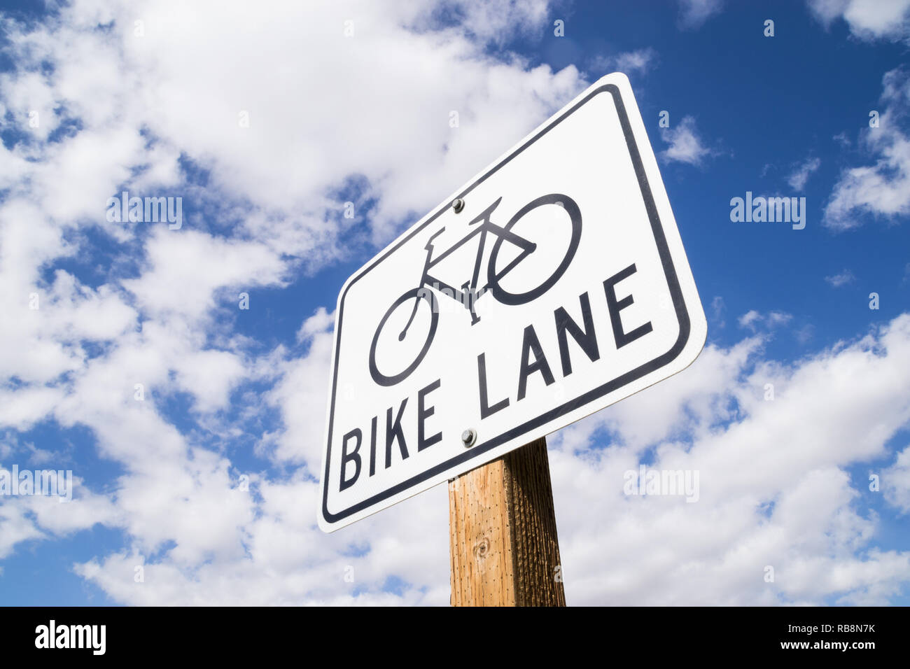 The "Bike Lane" street sign in the California sun Stock Photo - Alamy