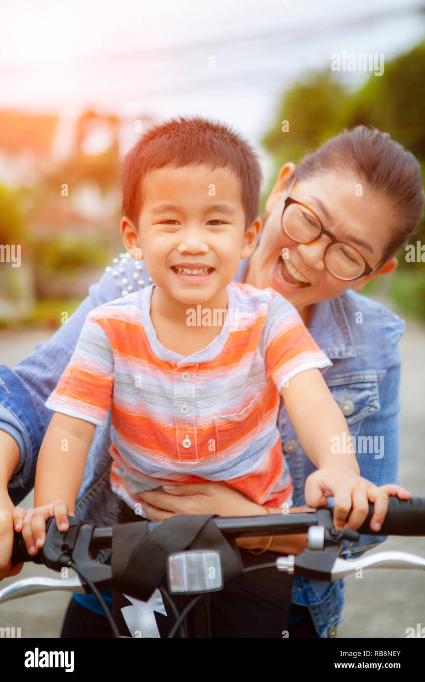 Children biking asian hi-res stock photography and images - Alamy