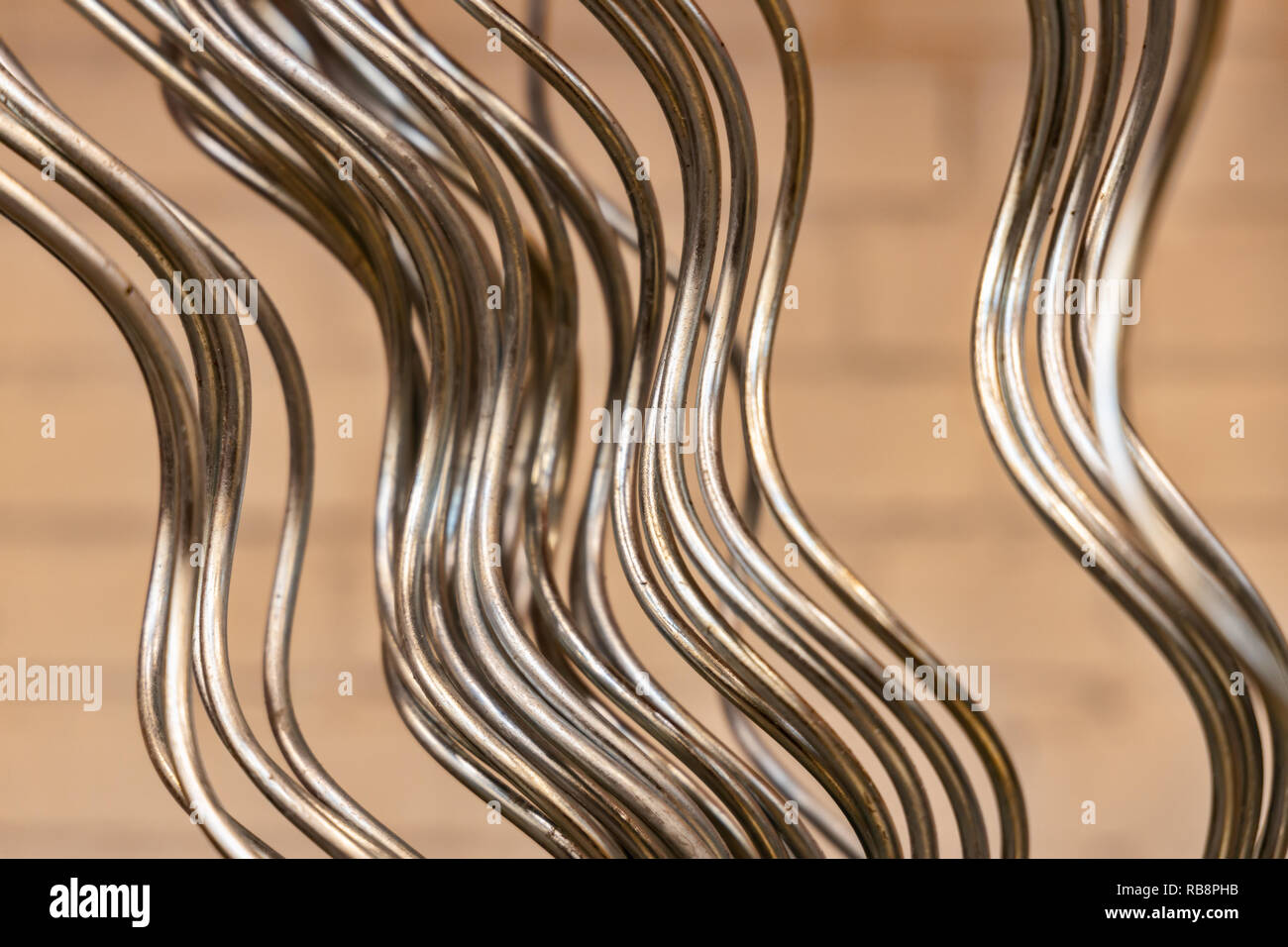 building material - curved rods in silver metal Stock Photo - Alamy