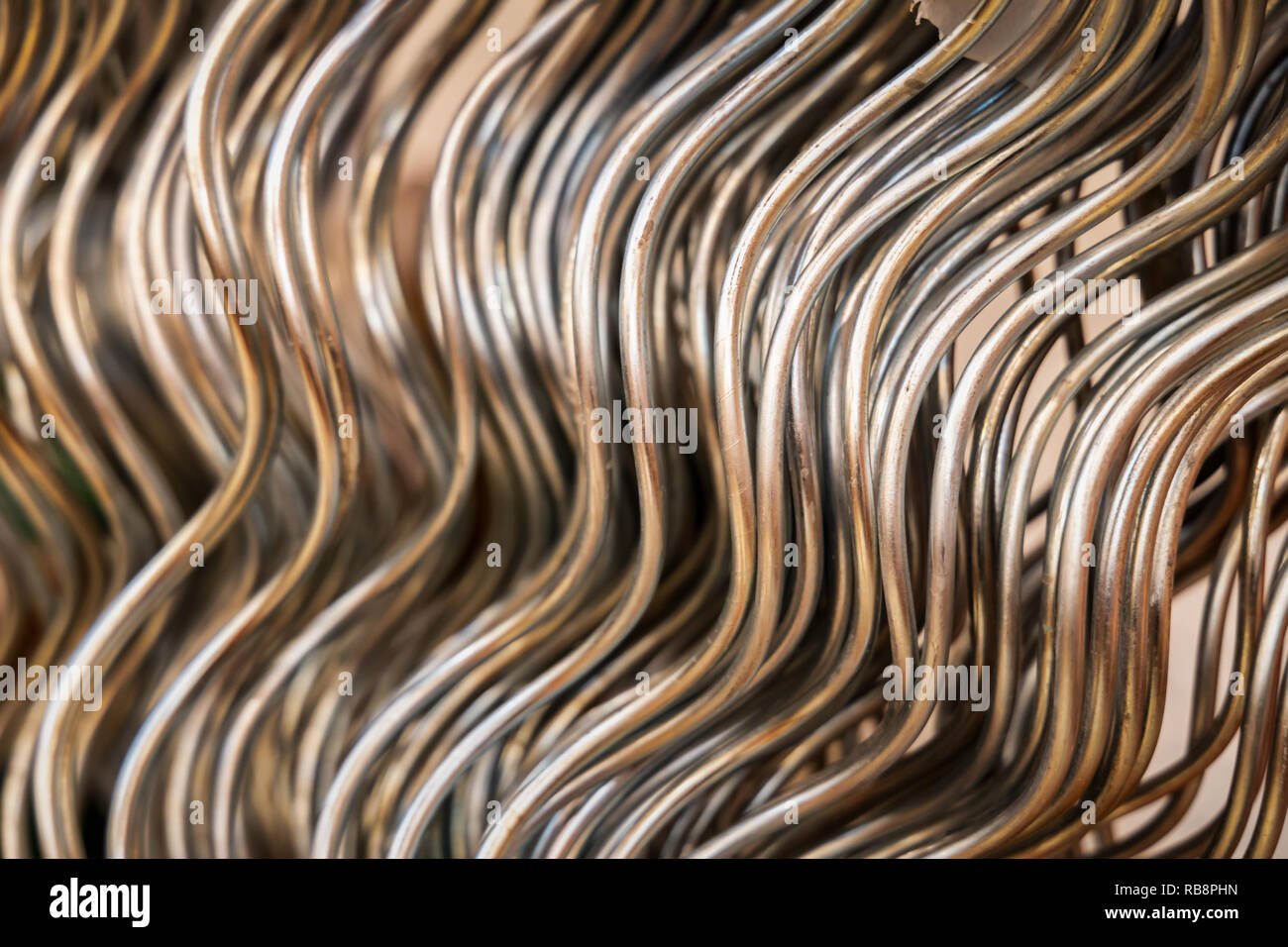 building material - curved rods in silver metal Stock Photo - Alamy
