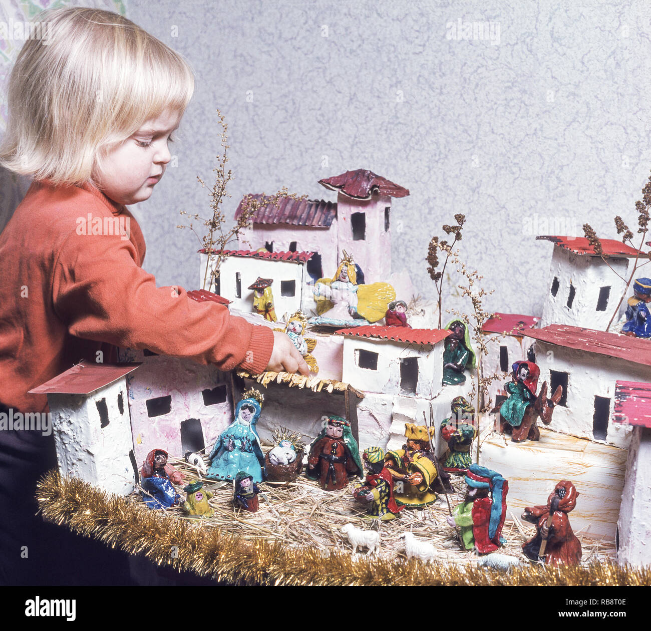 Young girl playing with a homemade nativity scene Stock Photo - Alamy