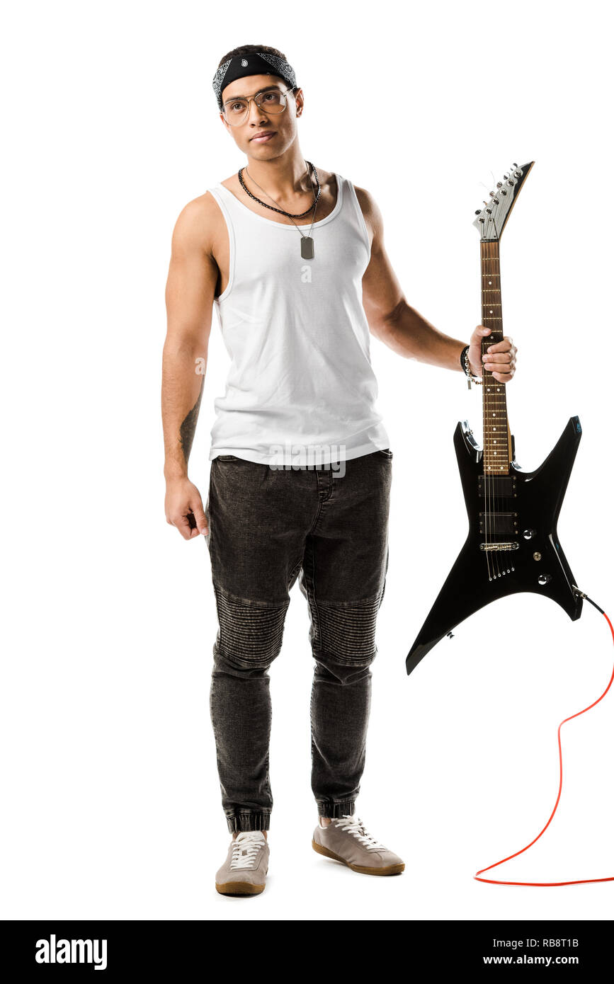 handsome male rock musician posing with black electric guitar isolated ...