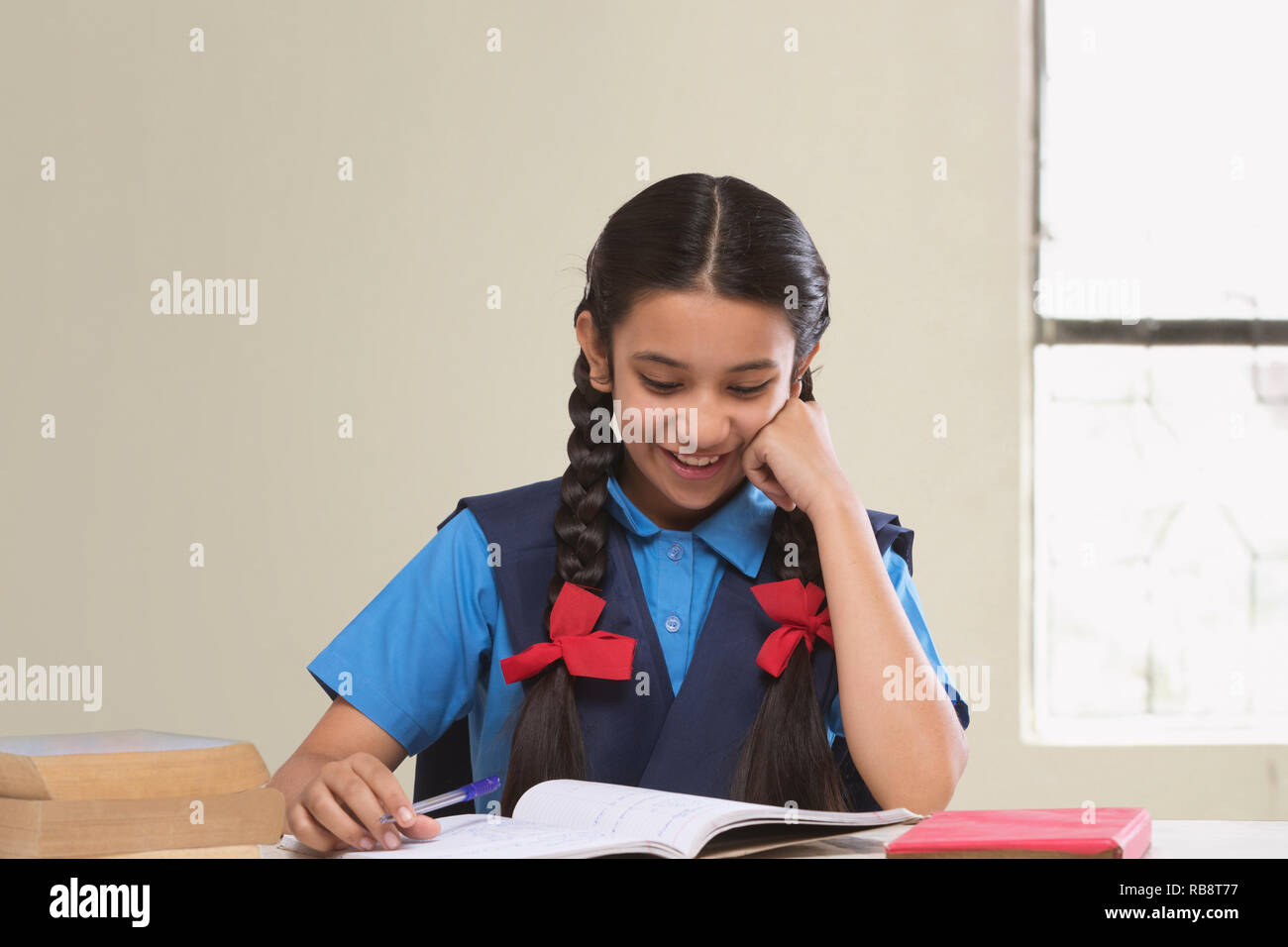 School uniform sitting hi-res stock photography and images - Alamy